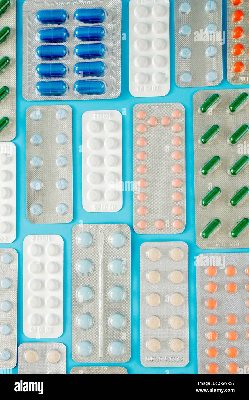 Colorful of tablets and capsules pill in blister packaging arranged ...