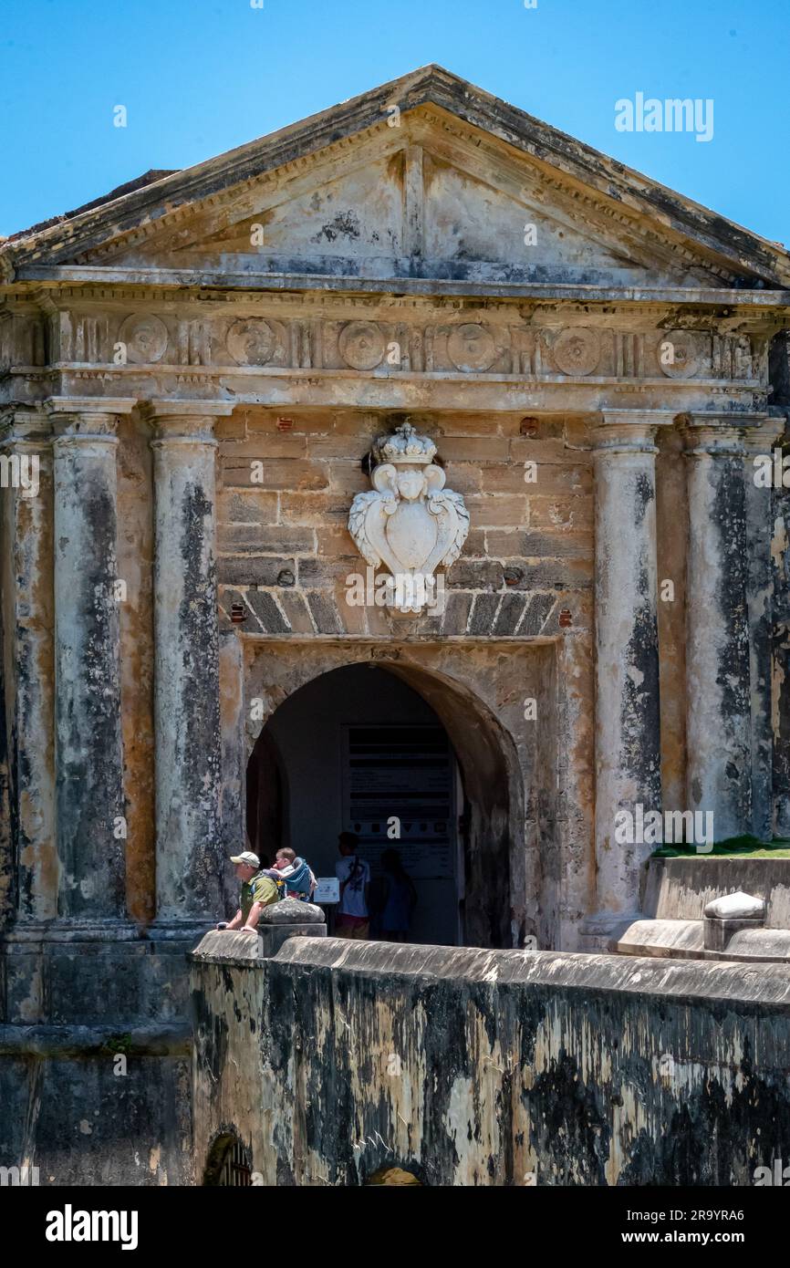 Visitor with baby in backpack at entrance to Castillo San Cristobal ...