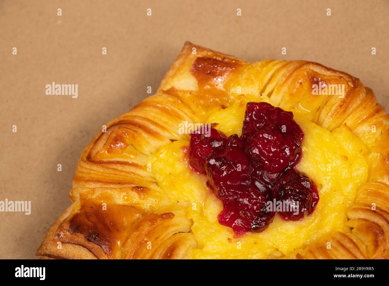 puff with cherry on a white background close-up Stock Photo - Alamy