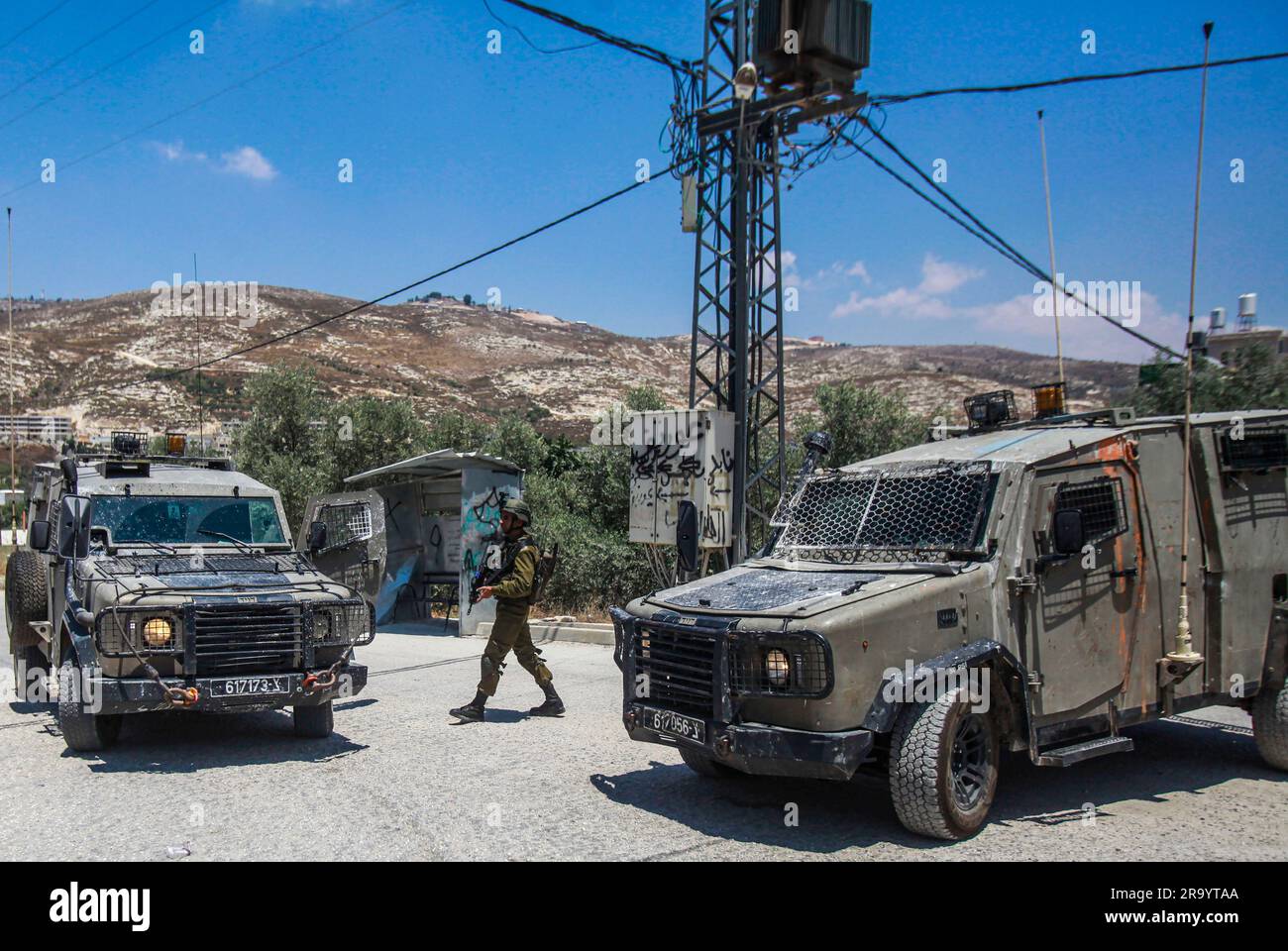 Nablus, Palestine. 29th June, 2023. An Israeli soldier guards the ...