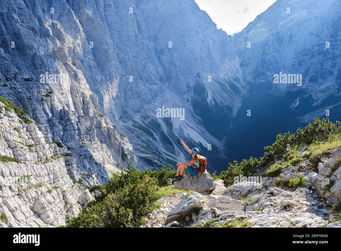 Impressive scale of mountains in Triglav National Park, Slovenia. Woman ...