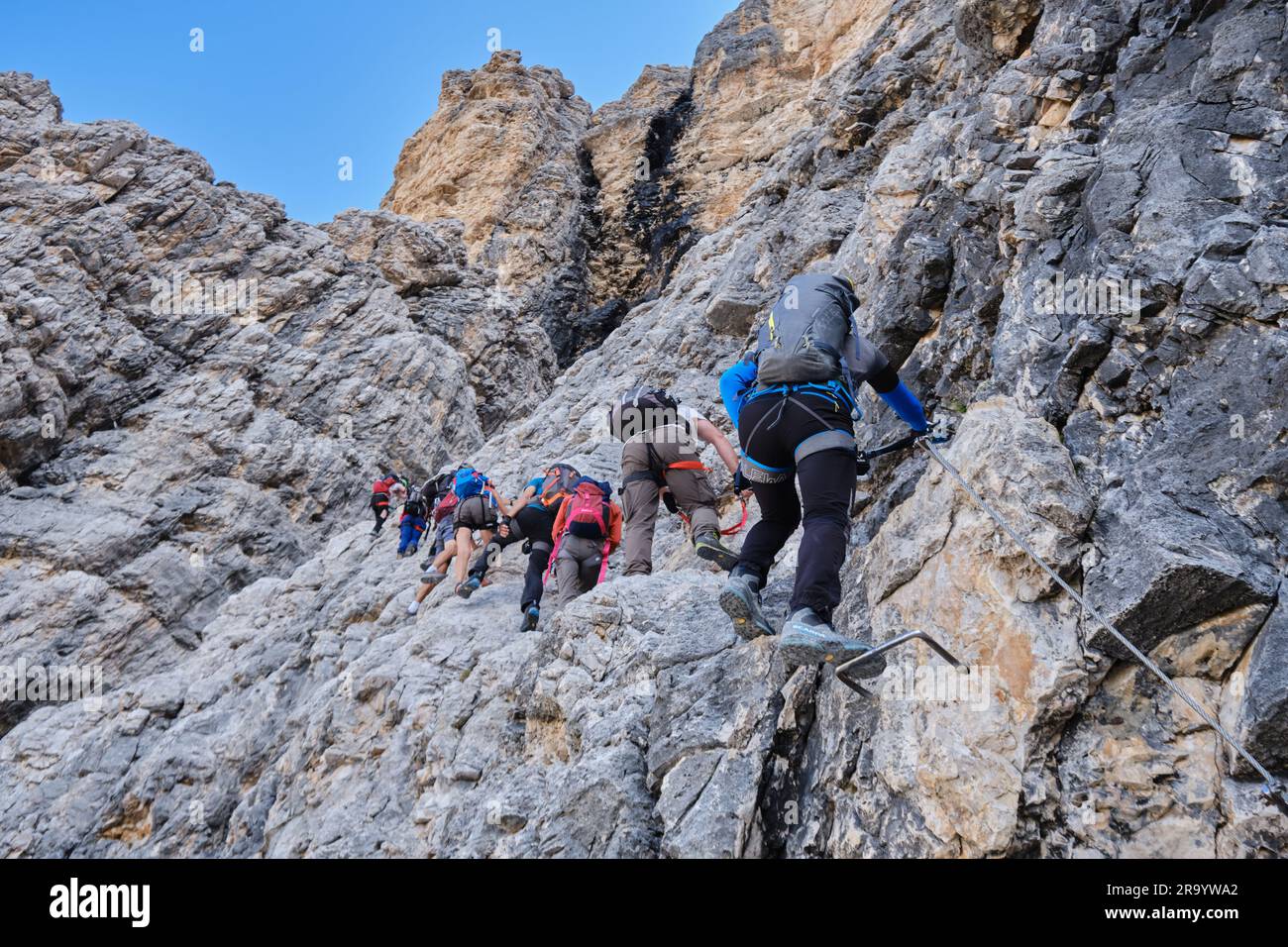 People queue on crowded via ferrata Giovanni Lipella route, in ...