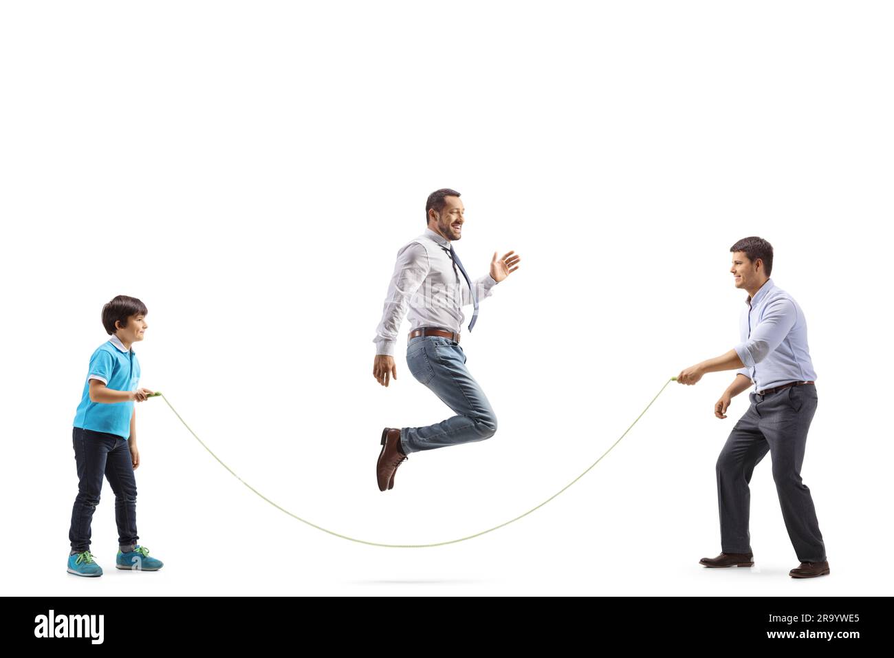 Boy and adults playing a skipping rope isolated on white background ...