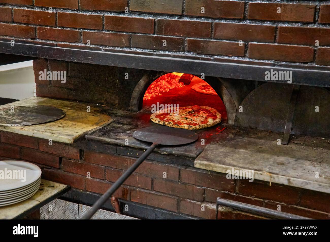 Baked tasty margherita pizza in Traditional wood oven in Naples ...