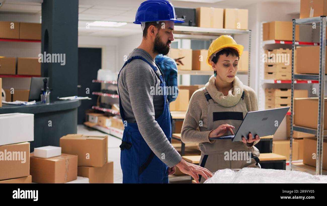 Caucasian people analyzing list of goods on tablet, working in ...