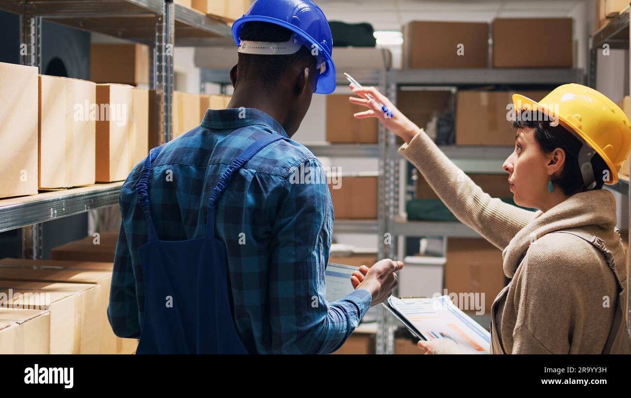 Diverse employees talking stock logistics hi-res stock photography and ...