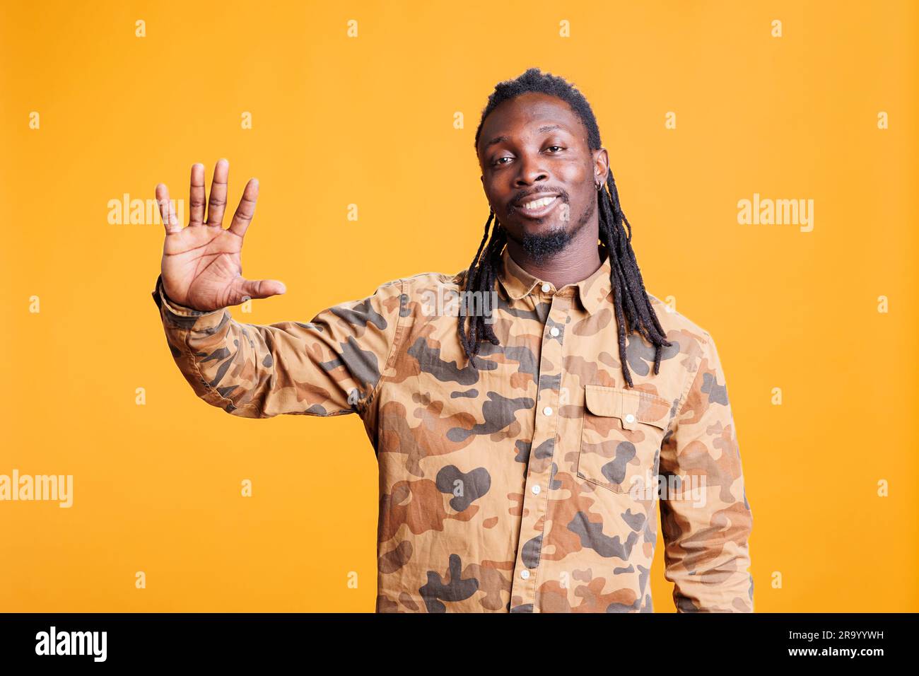 African man wave greet friend hi-res stock photography and images - Alamy
