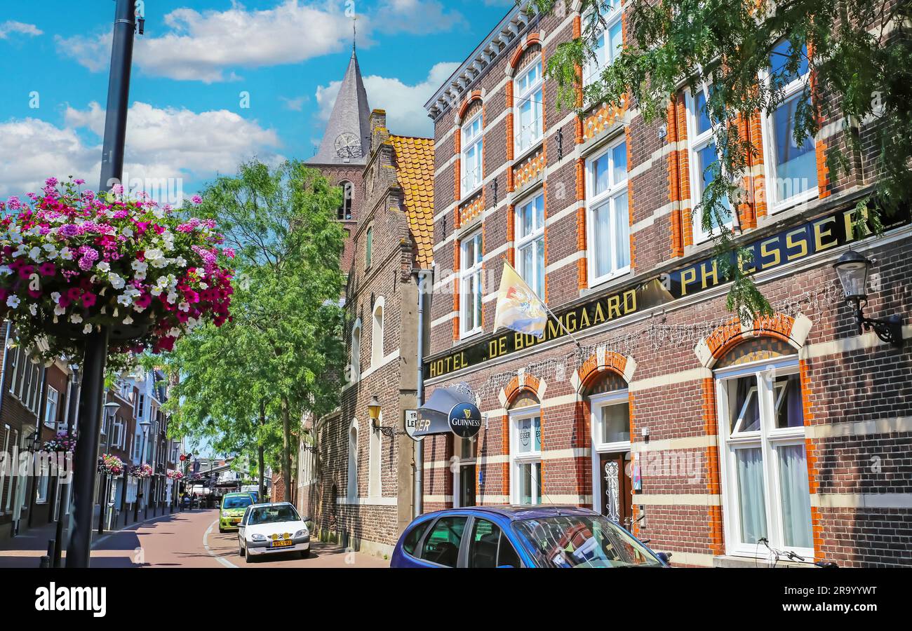 Boxmeer, Netherlands - July 9. 2023: Beautiful dutch town street, green ...