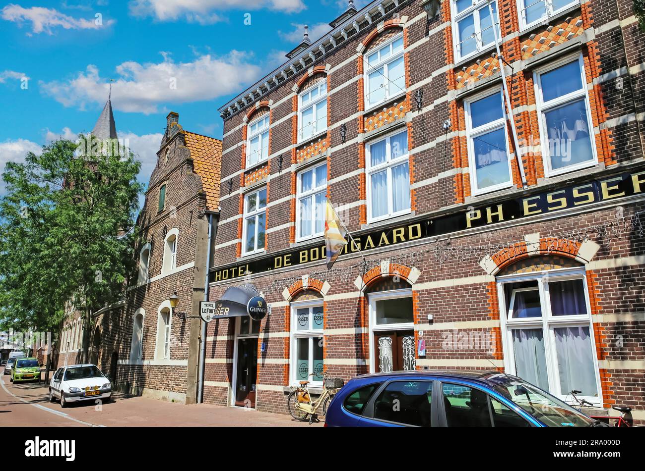 Boxmeer, Netherlands - July 9. 2023: Beautiful dutch town street, green ...