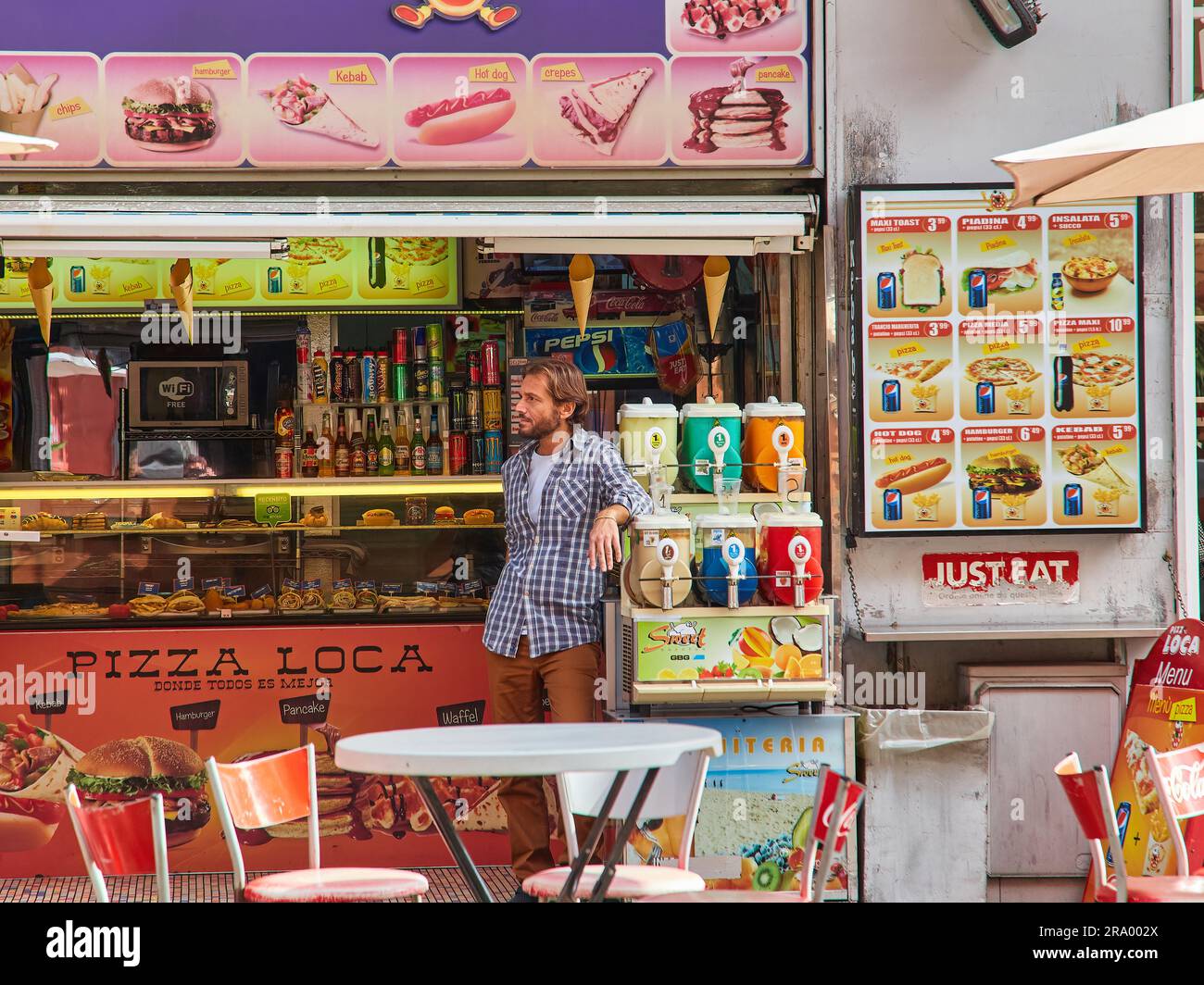 Naples, Italy - October 25, 2019 - street side cafe with traditional ...