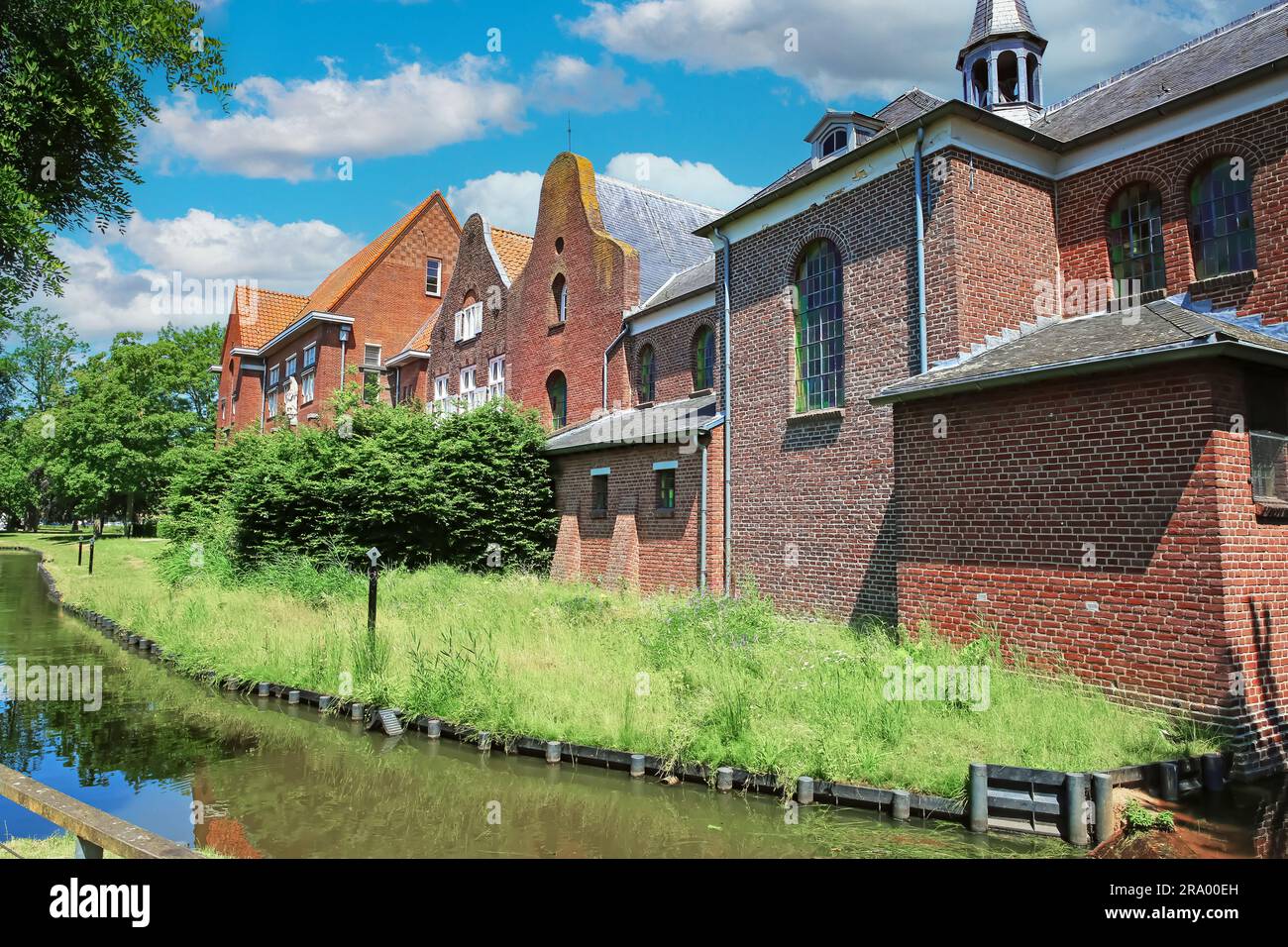 Ancient old red brick stone monastery building, water moat - Boxmeer ...