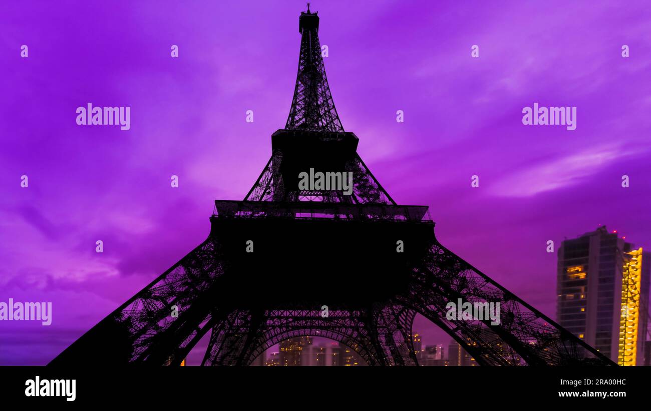 Magenta sky with clouds from sunset changing light to dark above Paris ...