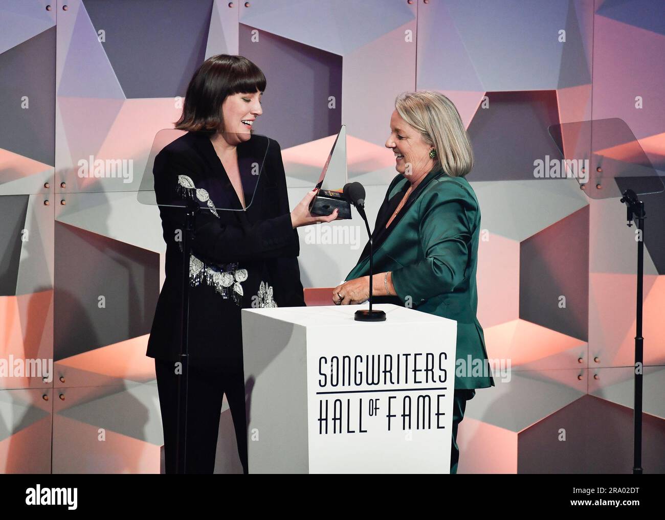 Caitlin Rose, left, inducts her mother Liz Rose at the 52nd annual ...