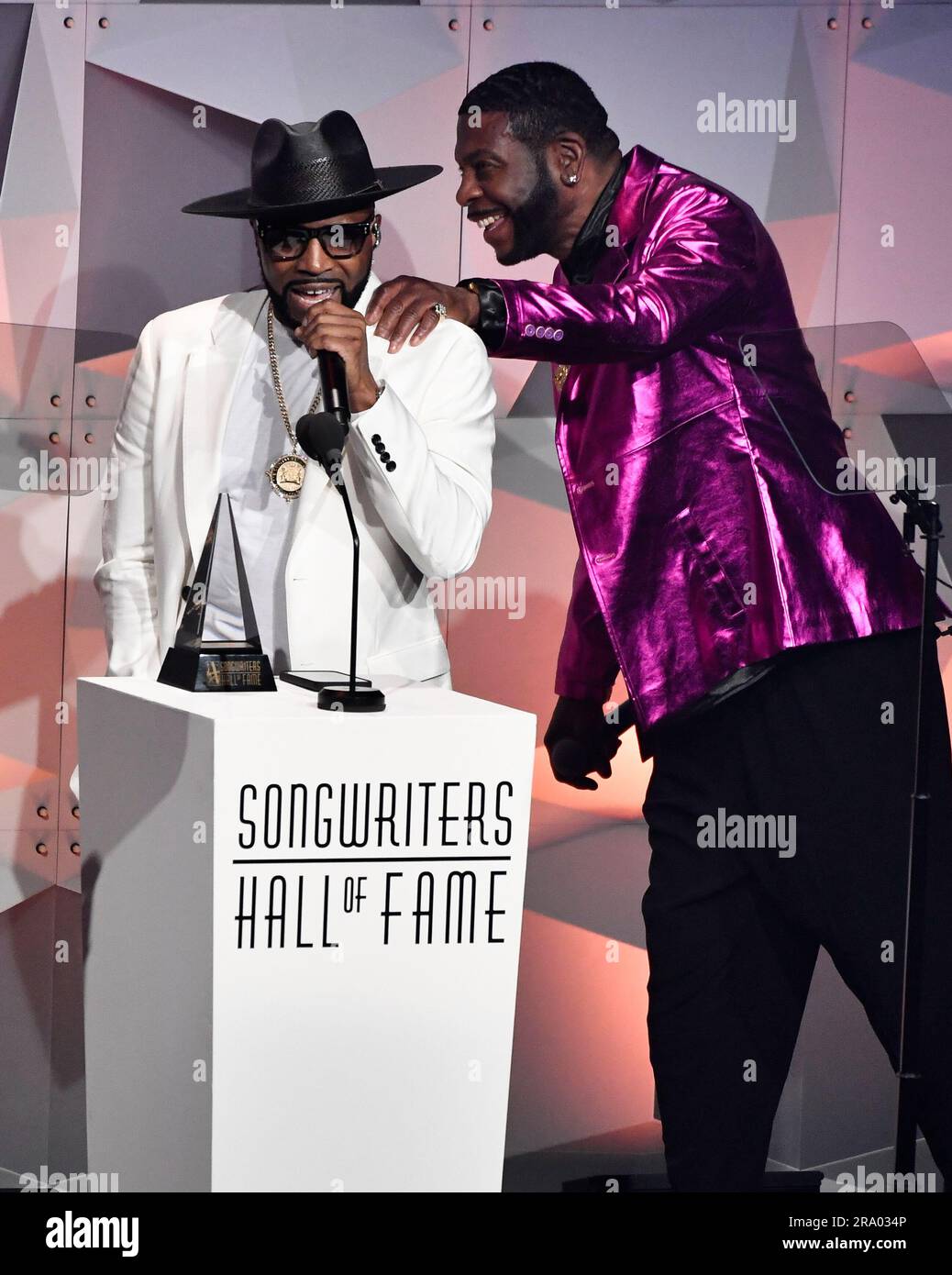Inductee Teddy Riley, left, gives his acceptance speech with Keith ...