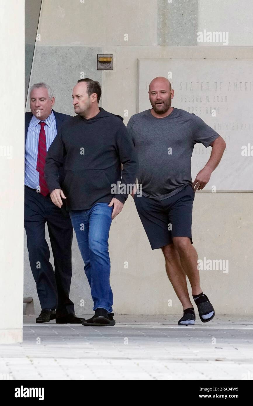 Michael Shvartsman, center, and his brother Gerald, right, leave the ...