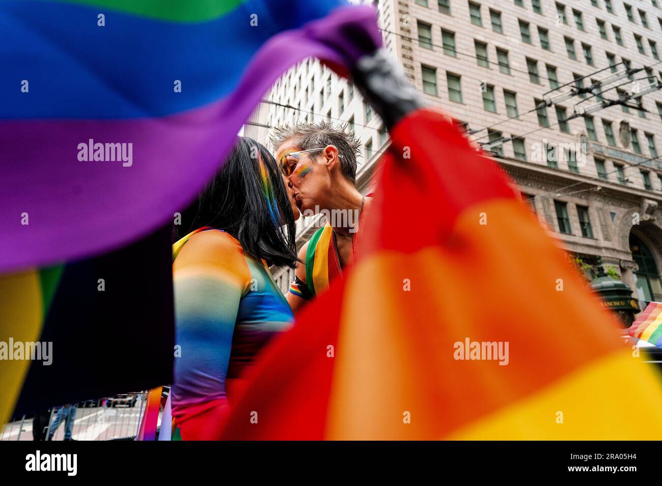 AnMarie Rodgers, right, and Jennifer Kanenaga kiss before kicking off ...