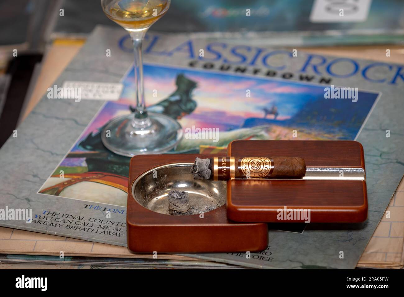 Cigar and whiskey on Classic Rock Countdown vinyl record. vintage ...