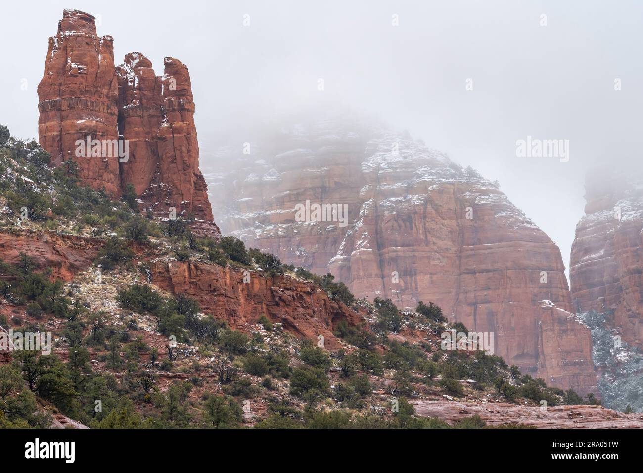 Red rock formations shrouded in fog, near Sedona, Arizona, USA, by ...
