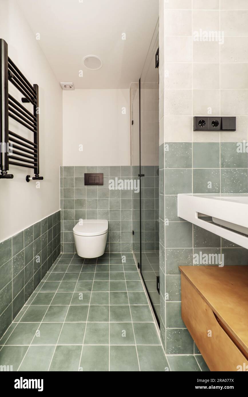 A newly installed modern bathroom with a hanging toilet, white ...