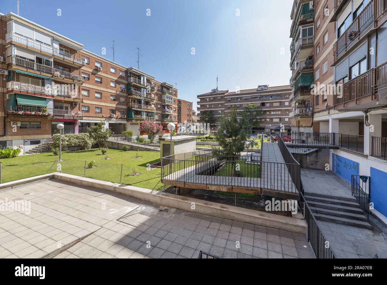 Interior common areas of an urbanization with access ramps and stairs ...