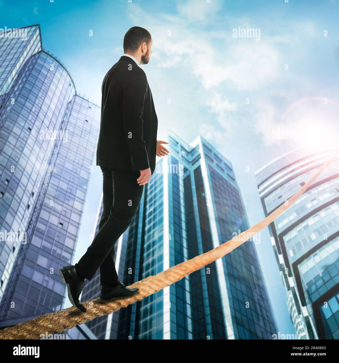 Risks and challenges of entrepreneurship. Businessman walking on rope ...