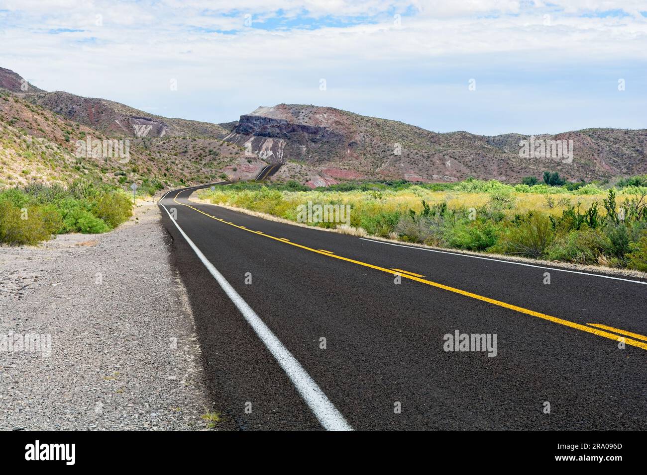 Two lane route 170 roadway cuts through canyon in Chihuahuan Desert of ...