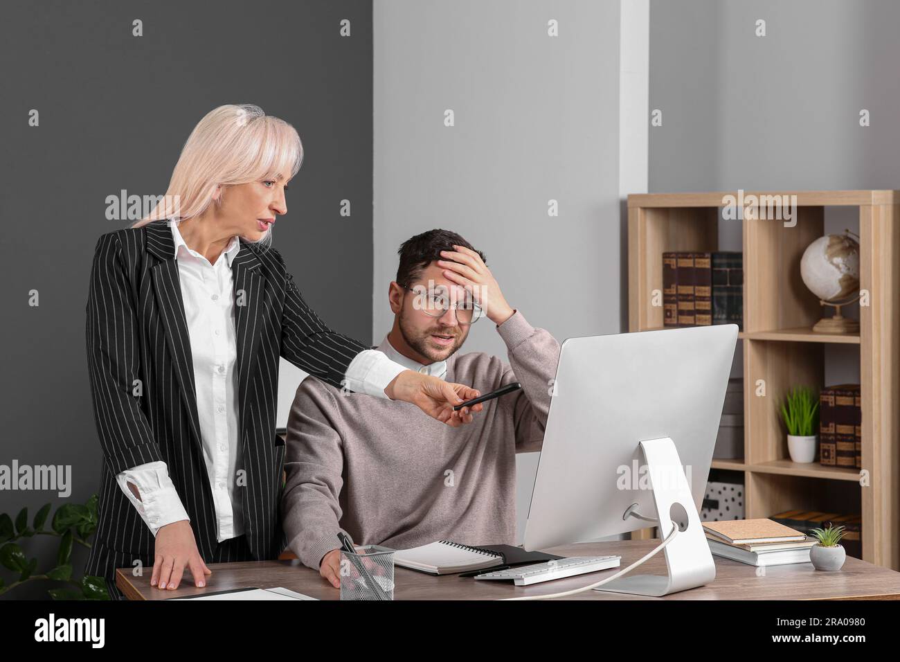 Confused female employee hi-res stock photography and images - Alamy