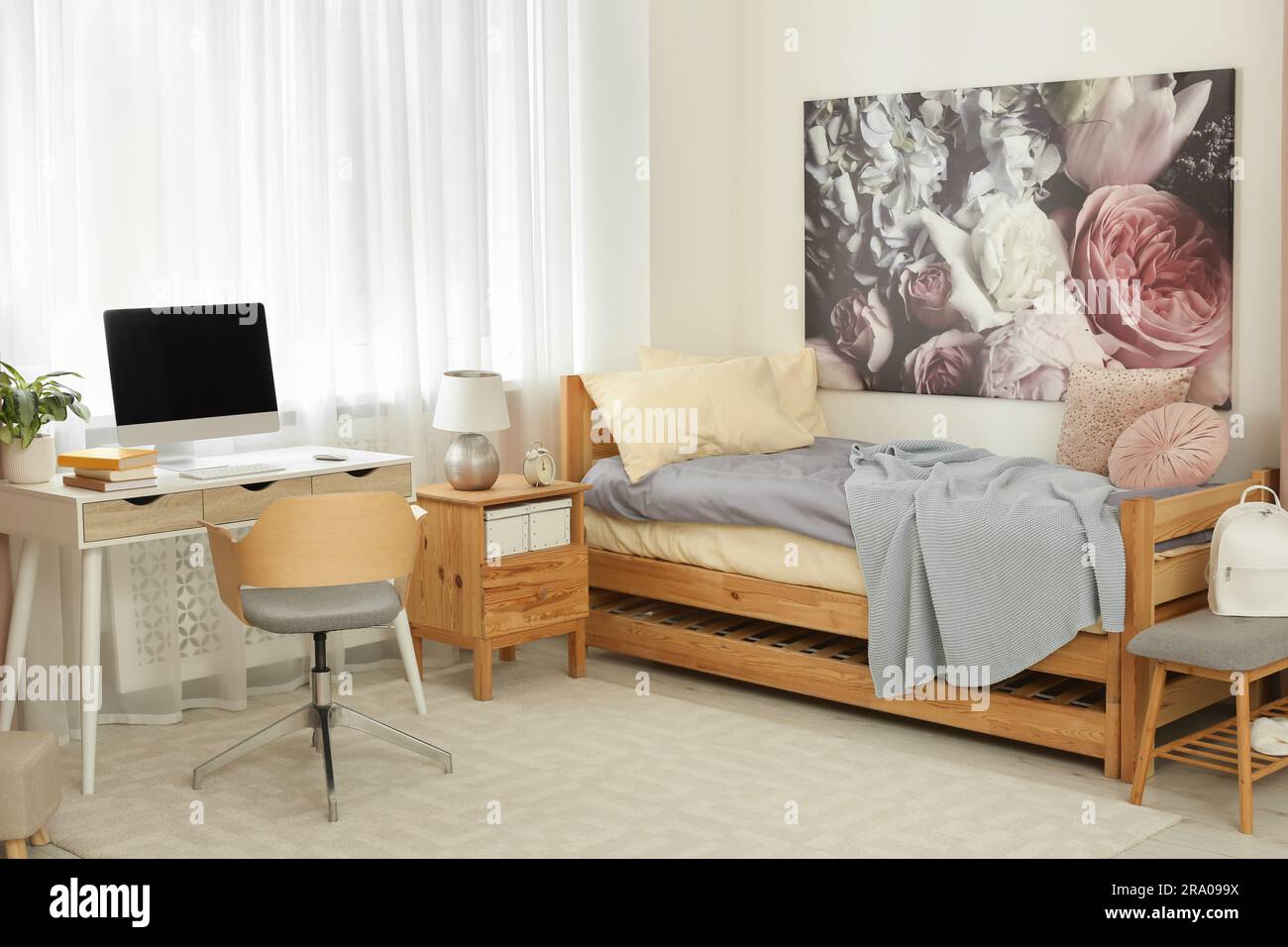 Stylish teenager's room interior with computer and comfortable bed ...