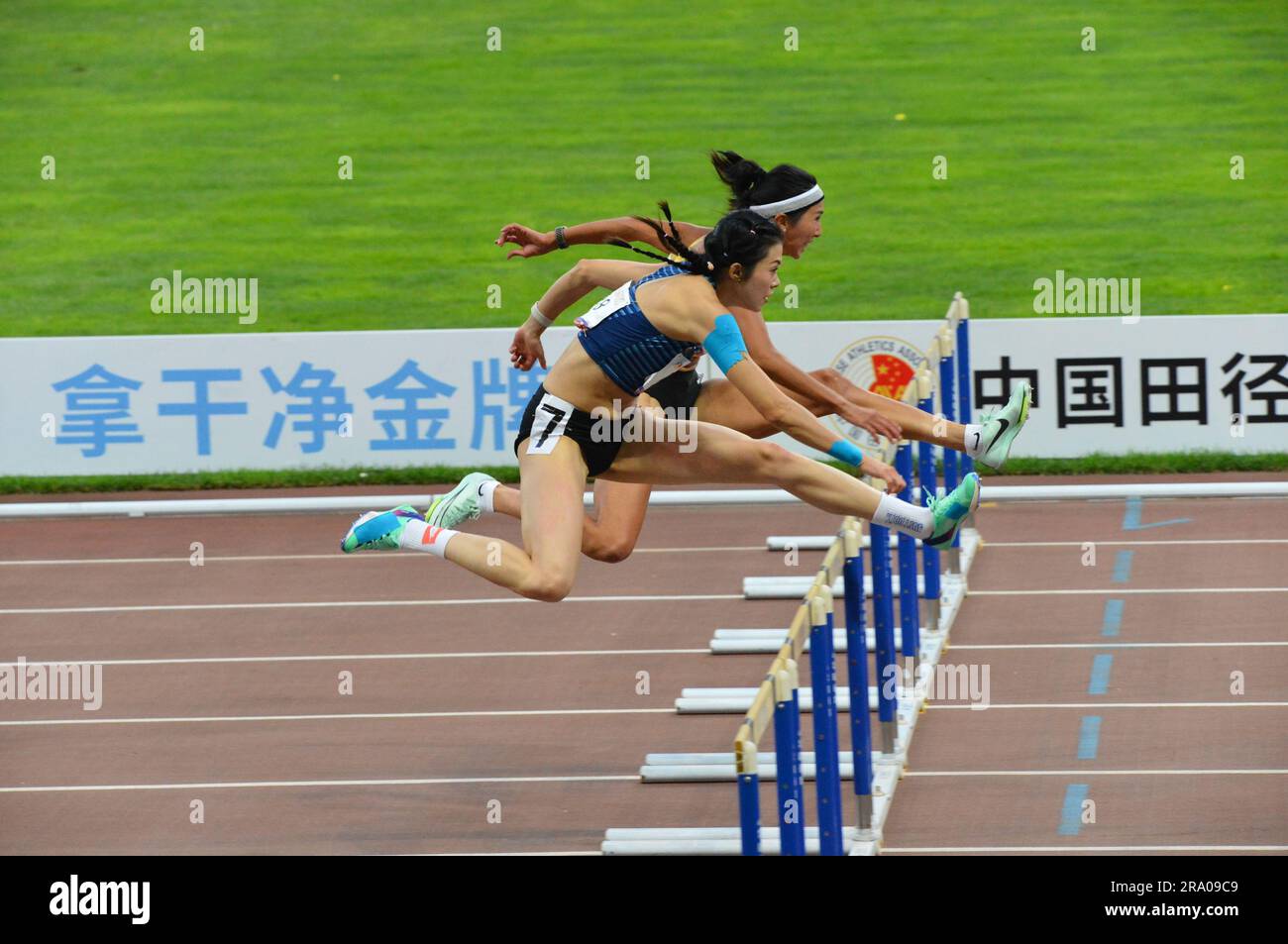 HANGZHOU, CHINA - JUNE 29, 2023 - Runners compete in the women's 100m ...