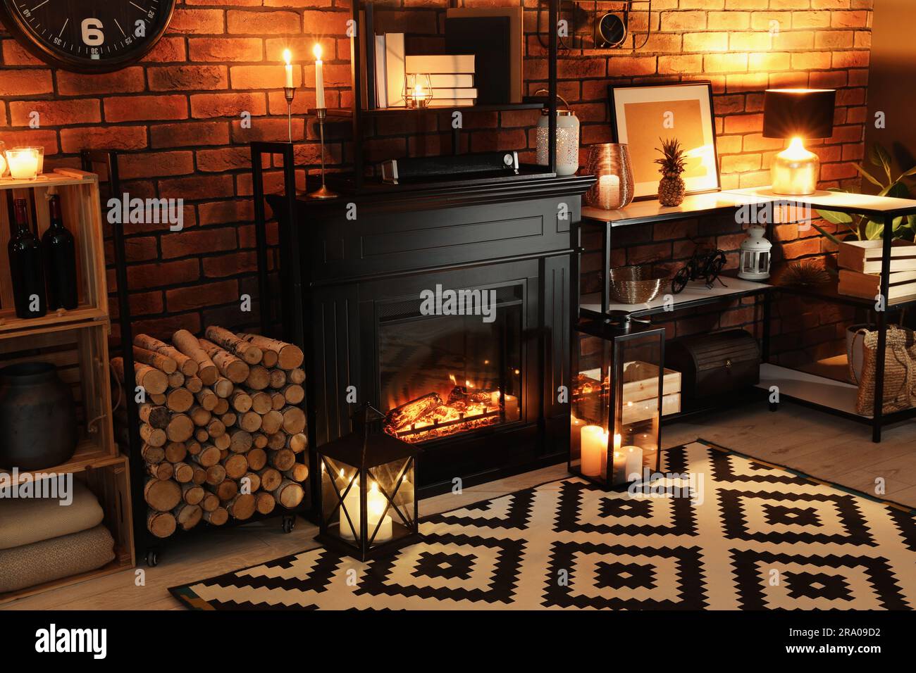 Beautiful fireplace and different decor in living room at night ...