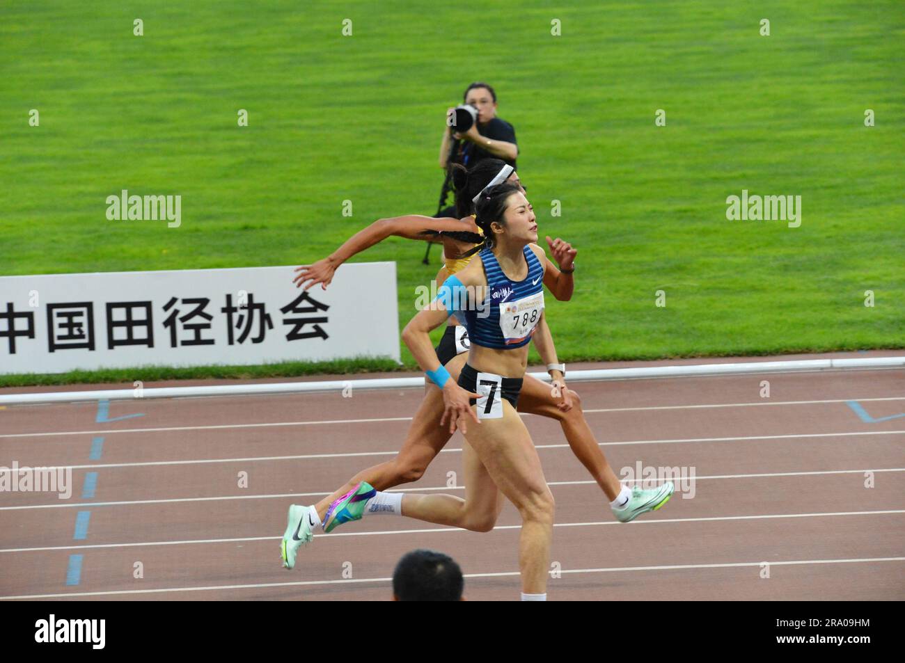 HANGZHOU, CHINA - JUNE 29, 2023 - Runners compete in the women's 100m ...