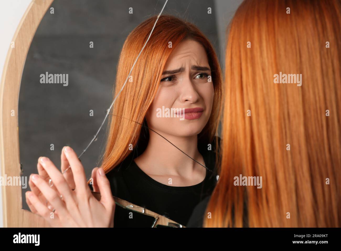 Female look in the mirror fear hi-res stock photography and images - Alamy