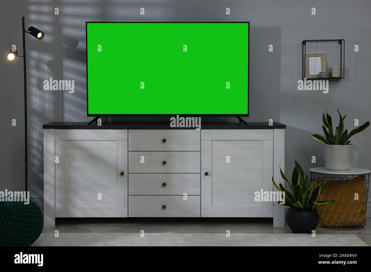 Chroma key compositing. TV with mockup green screen in room. Mockup for ...