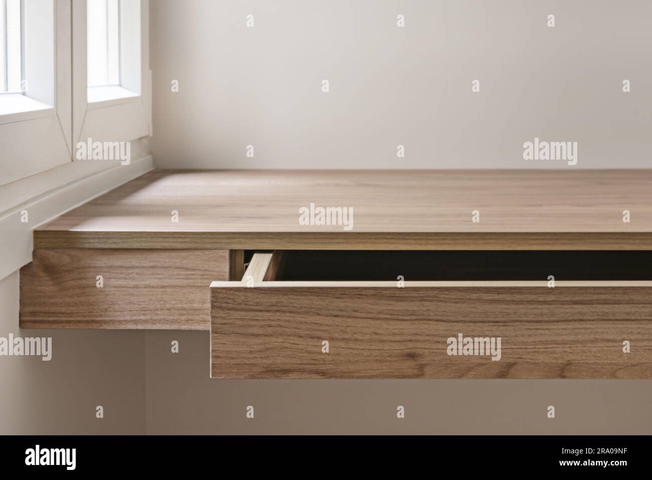 Custom made wooden study desk with integrated drawer Stock Photo - Alamy
