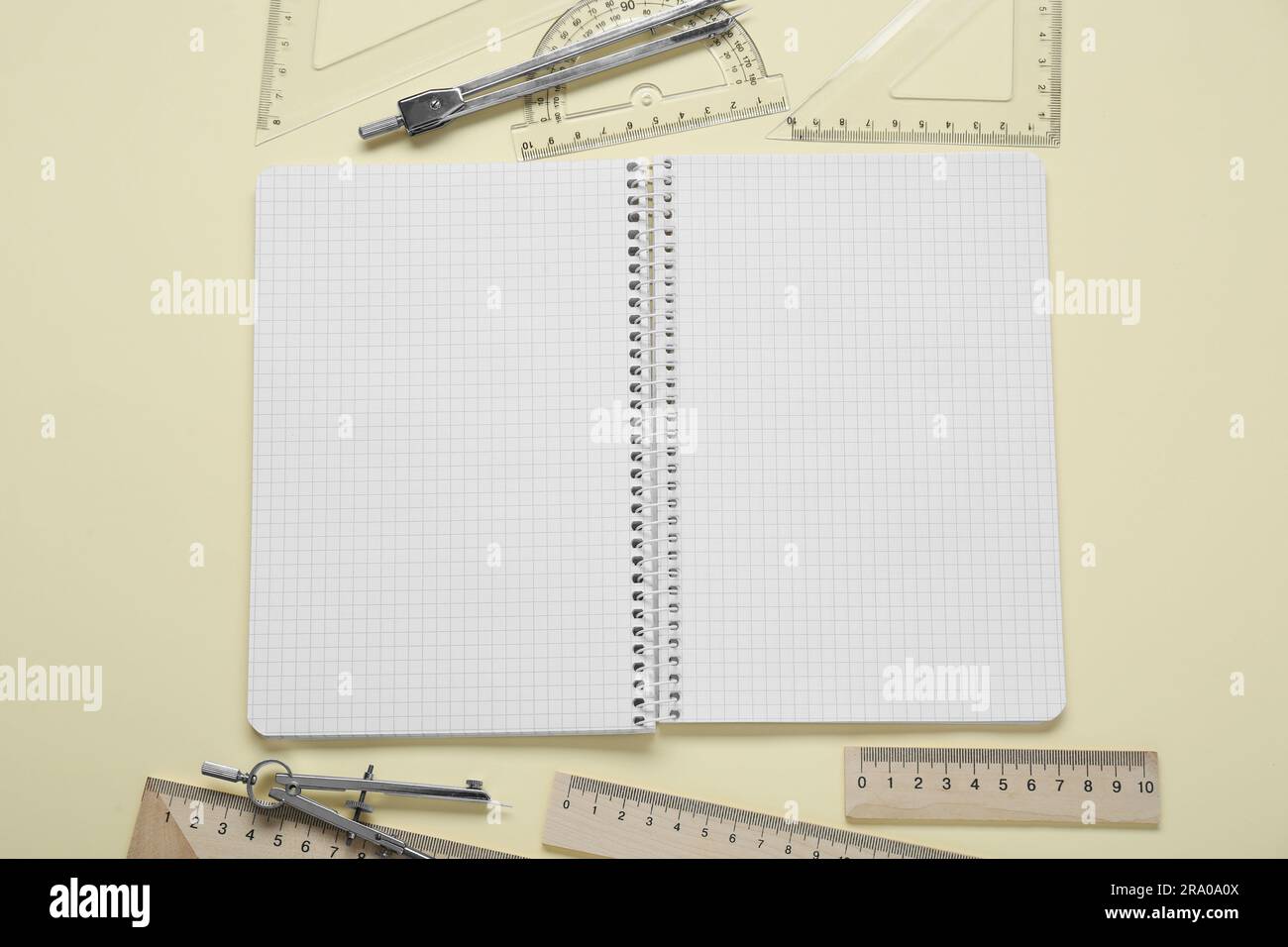 Flat lay composition with different rulers and compasses on yellow ...