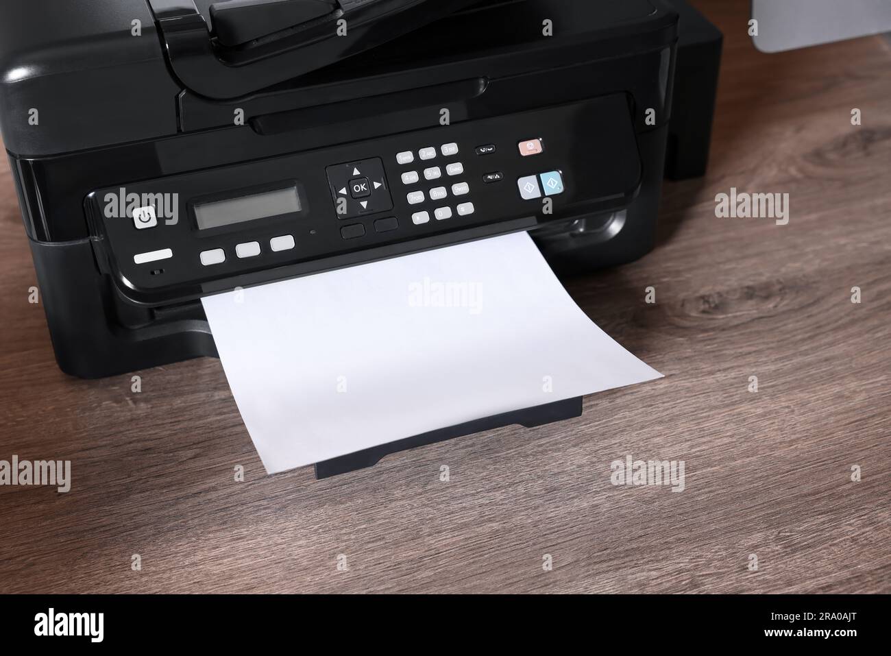 Modern printer with paper on wooden desk at home, closeup Stock Photo ...