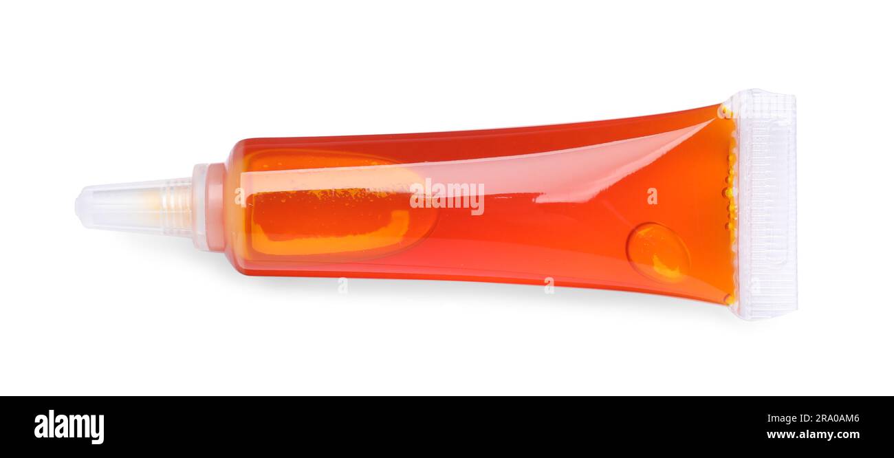 Tube with orange food coloring isolated on white, top view Stock Photo ...