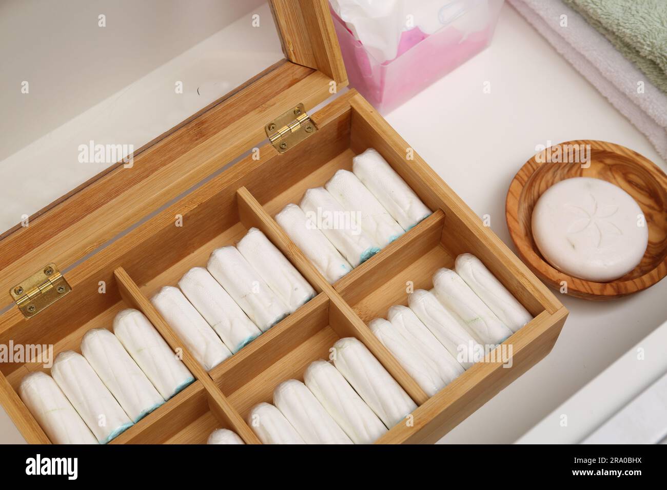 Storage of tampons and different hygiene products in white drawer ...