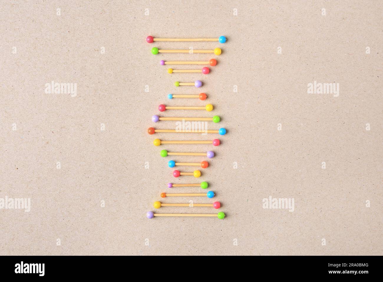 Model of DNA molecular chain on beige background, top view Stock Photo ...