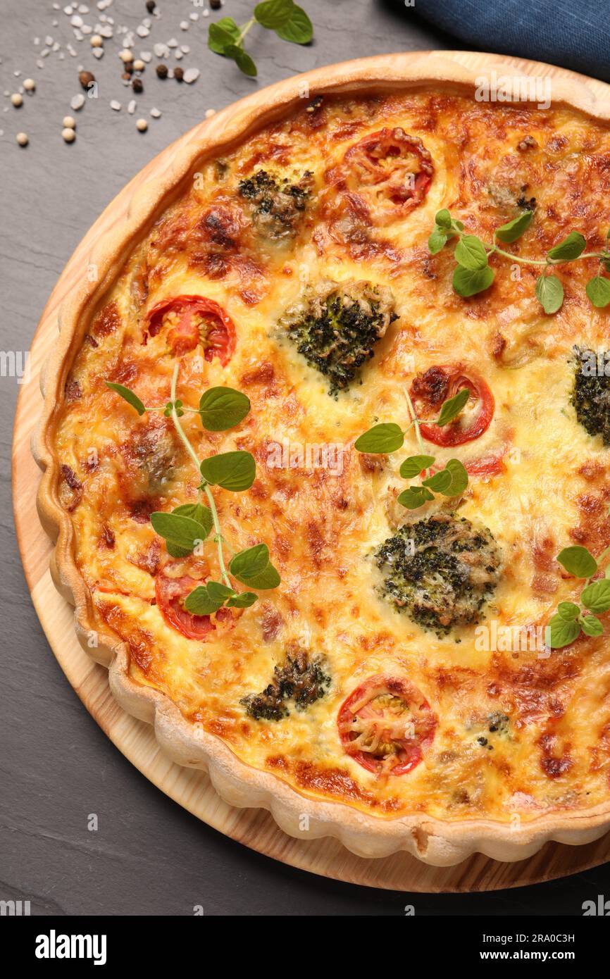 Delicious homemade vegetable quiche on dark table, top view Stock Photo ...