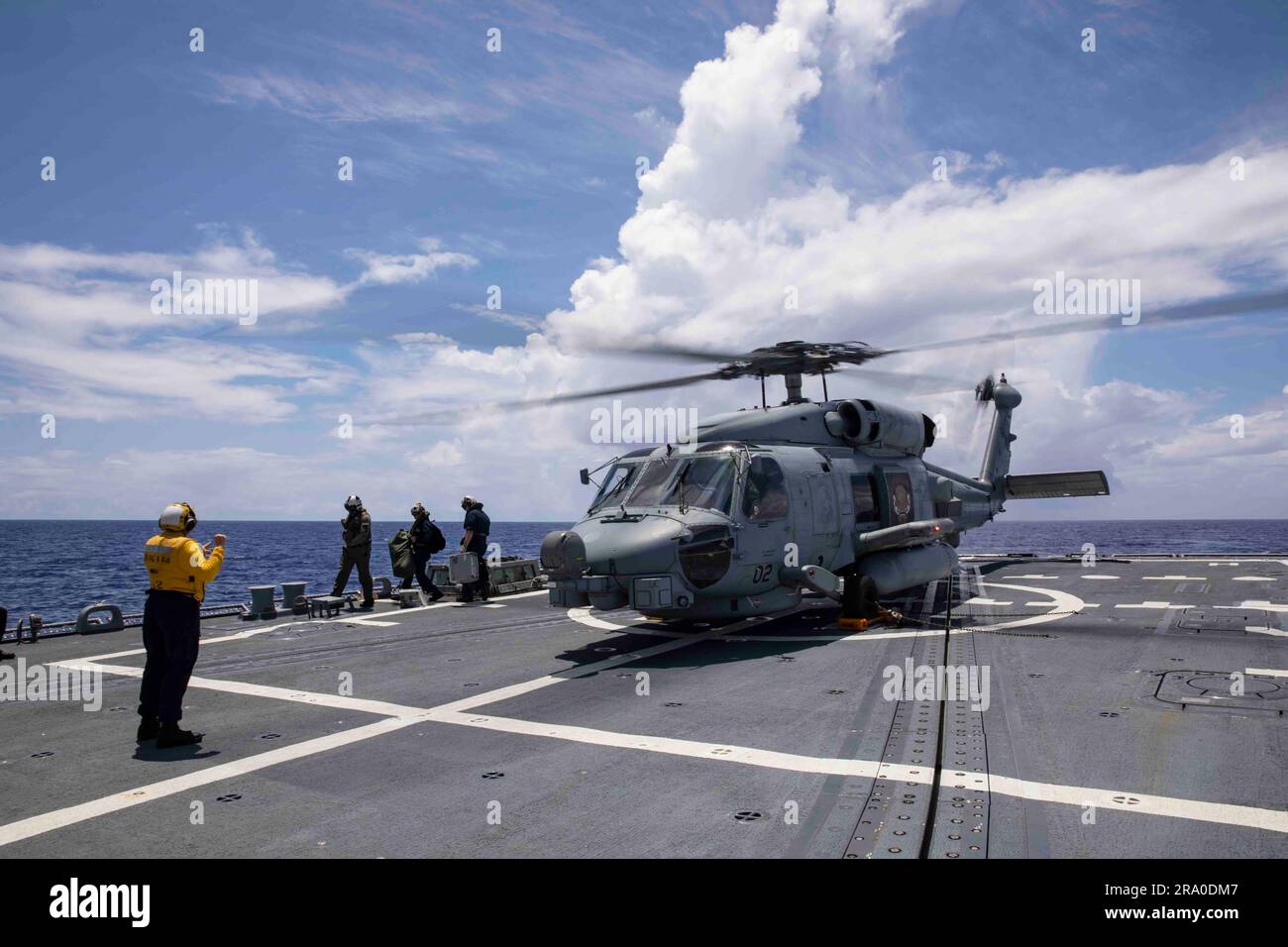 PHILIPPINE SEA (June 29, 2023) Sailors depart an MH-60R Sea Hawk ...