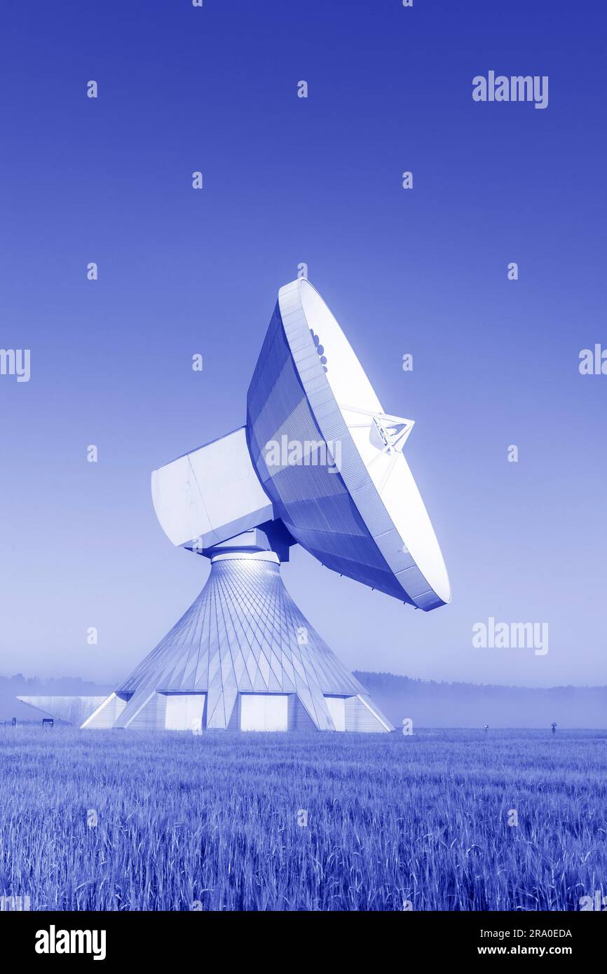 Large parabolic antenna of the earth station near Raisting, blue tinted ...