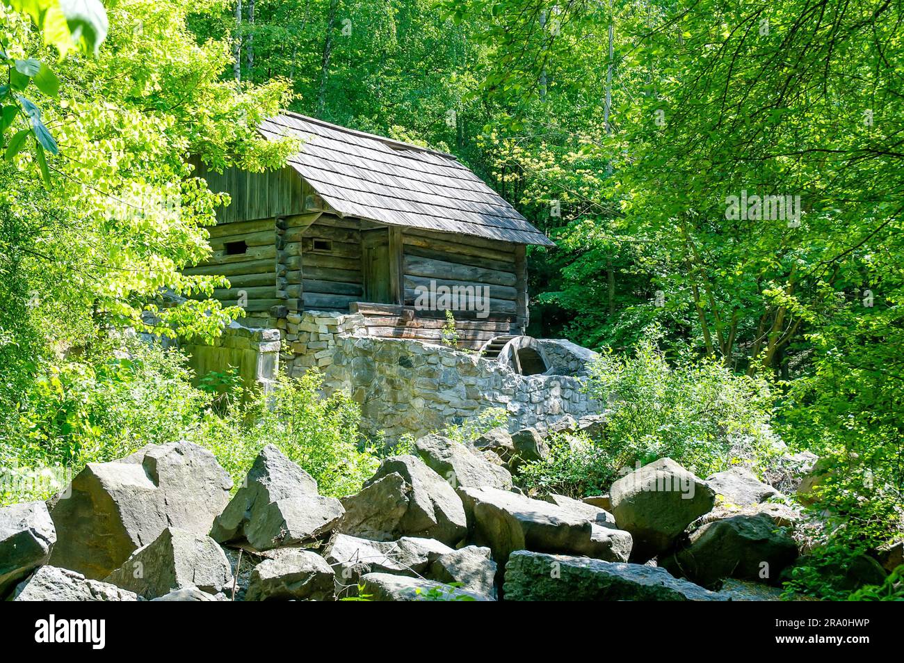 A typical ukrainian antique stone house in the forest, in Pirogovo near ...