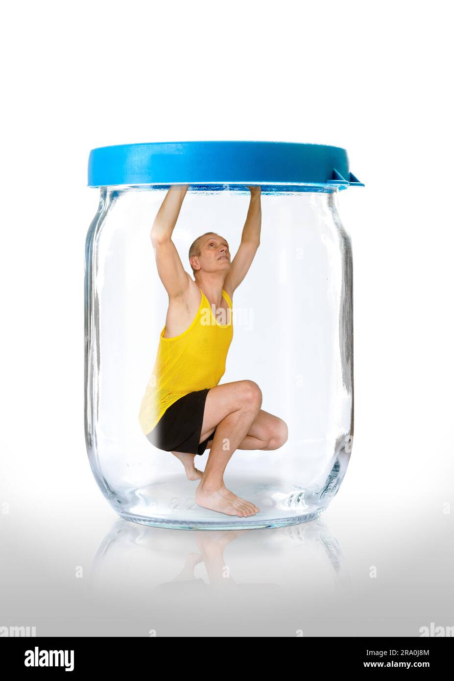 A man trapped in a glass jar with the closed blue color lid Stock Photo ...