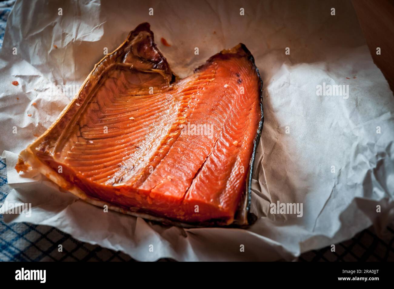 Smoked salmon from the Russian Kamchatka on white paper Stock Photo - Alamy