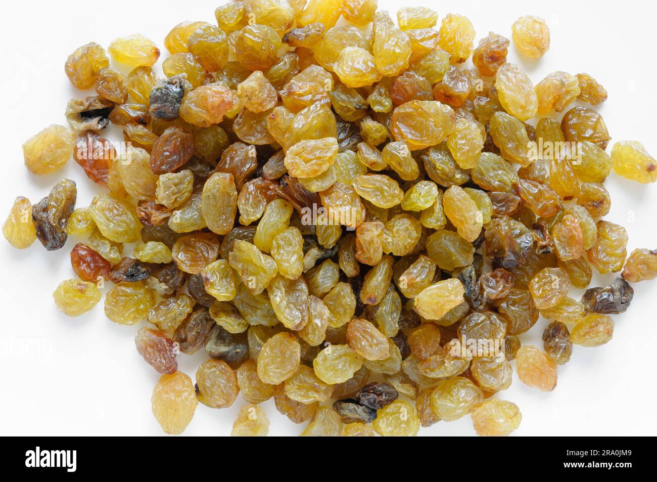 A heap of sweet dry raisin on white background Stock Photo - Alamy