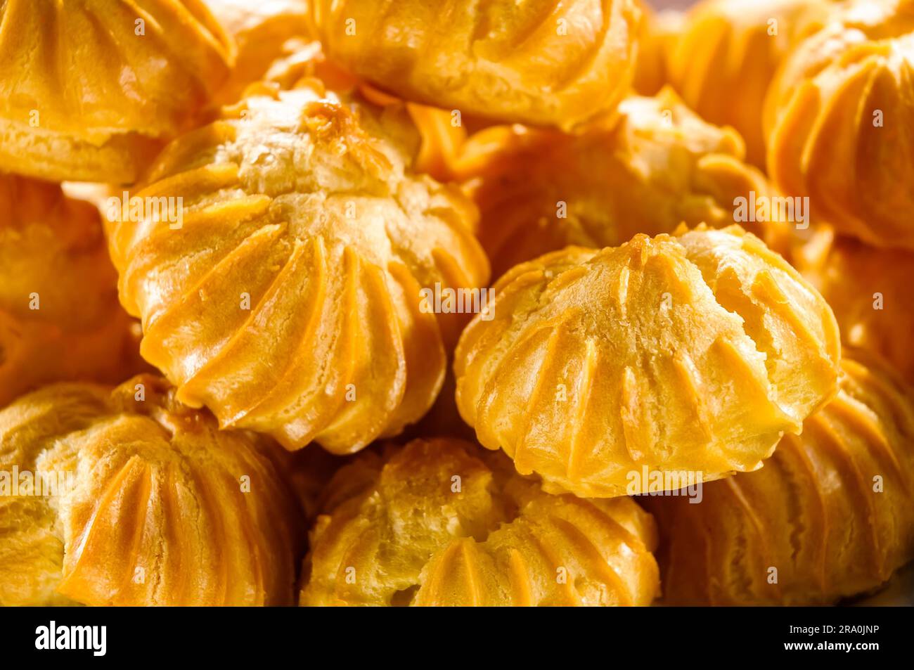 Close-up of sweet and tasty golden puffs Stock Photo - Alamy