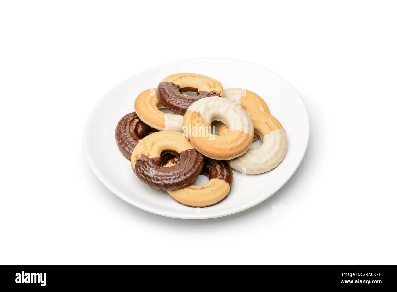 Ring shaped chocolate biscuits in a porcelain plate isolated on white ...