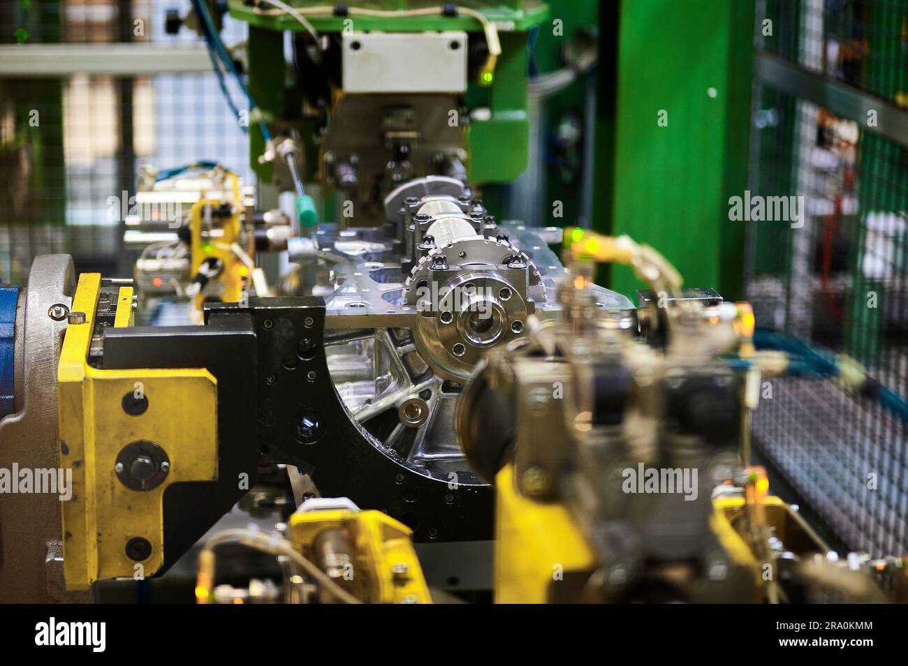 Illuminated car engine on test stand in production plant shop Stock ...