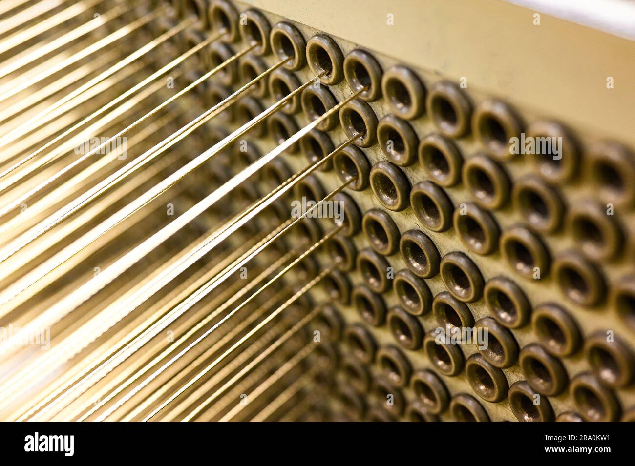 Strained cables pull out from holes of machine tool in shop Stock Photo ...